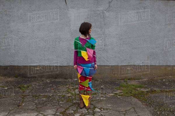 Young woman wrapped in bunting - Royalty-free Stock Photo | Dissolve