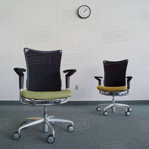 Empty office chairs in office - Royalty-free Stock Photo | Dissolve