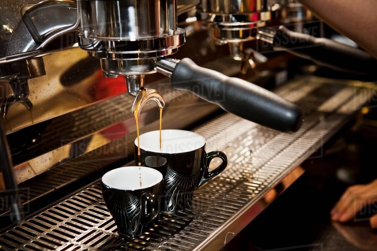 Barista making a latte - Royalty-free Stock Photo | Dissolve