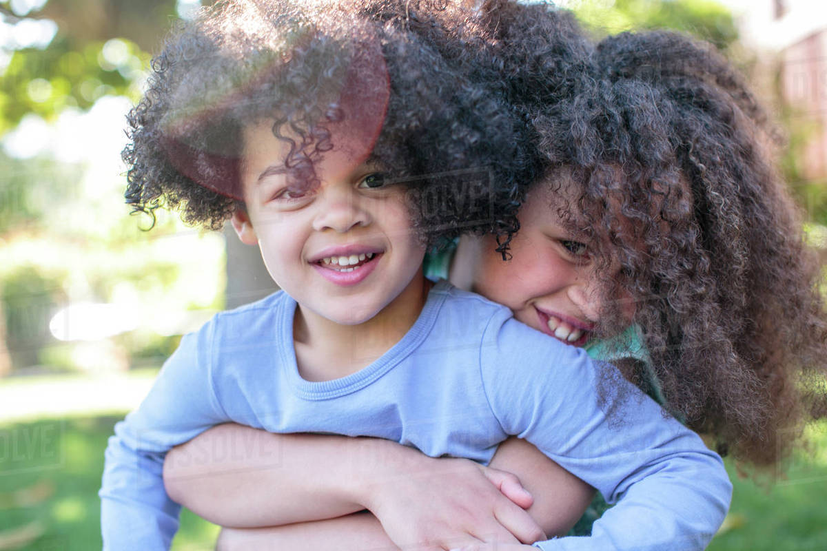Portrait of two sisters, hugging, smiling - Royalty-free Stock Photo ...
