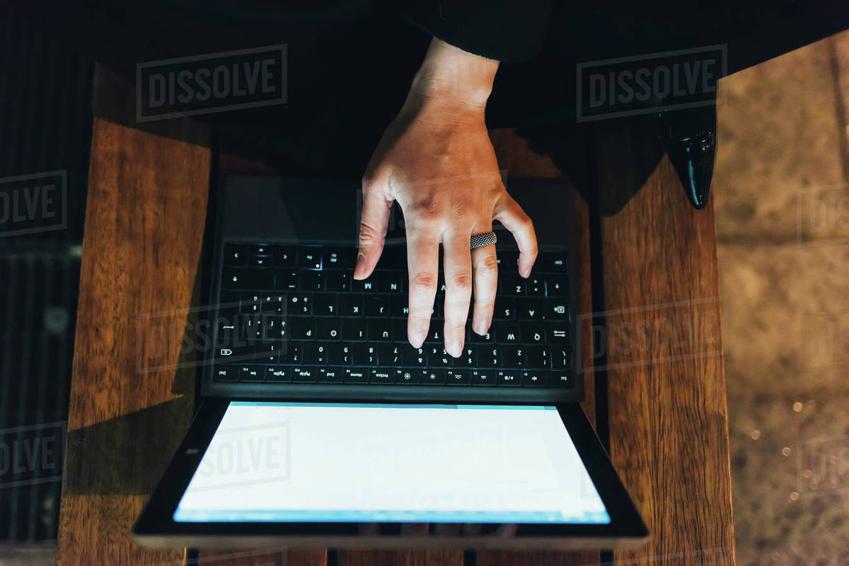 Businesswoman using laptop - Stock Photo - Dissolve