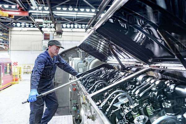 Locomotive engineer working on locomotive in train works - Stock Photo ...