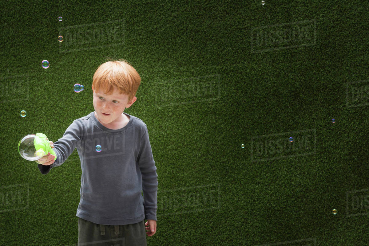 Boy making bubble maker - Royalty-free Stock Photo | Dissolve