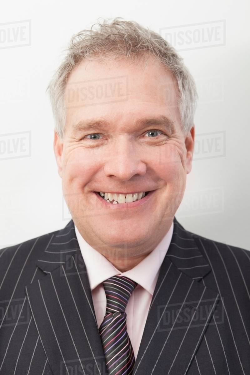Businessman smiling, portrait - Royalty-free Stock Photo | Dissolve