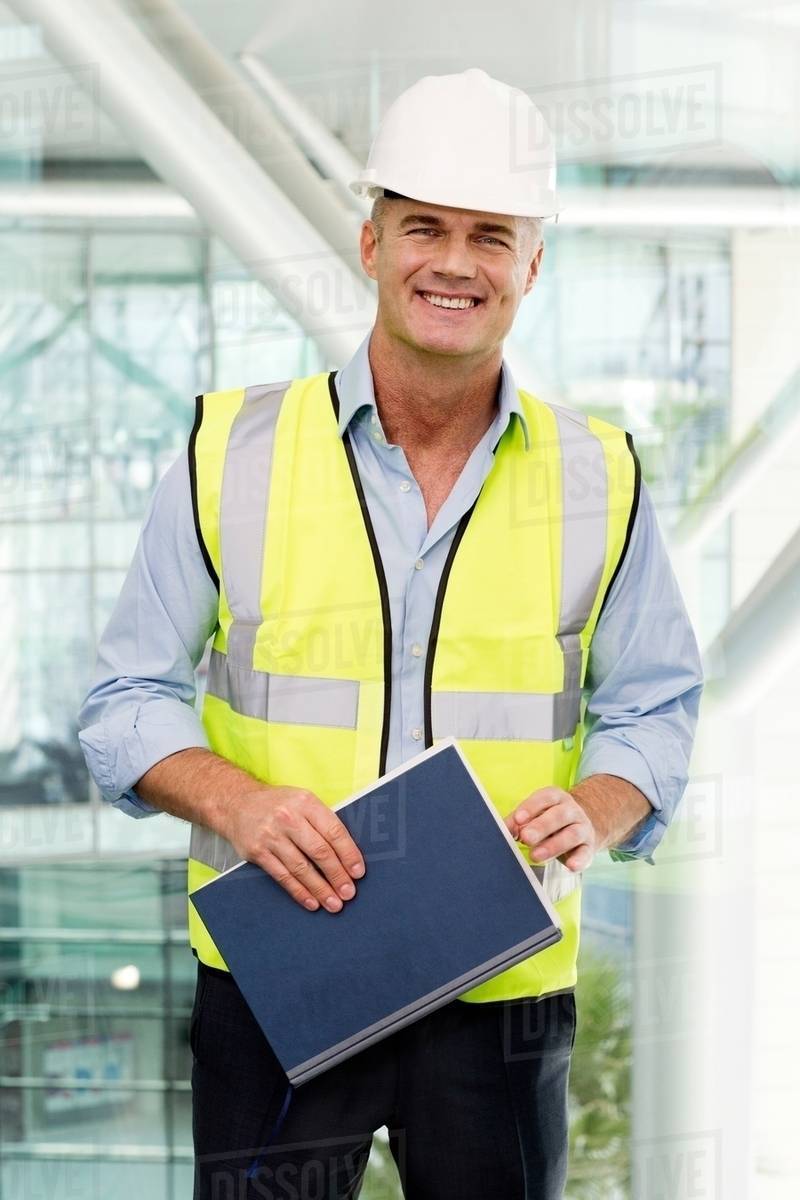 Portrait of engineer wearing hard hat in office - Royalty-free Stock ...