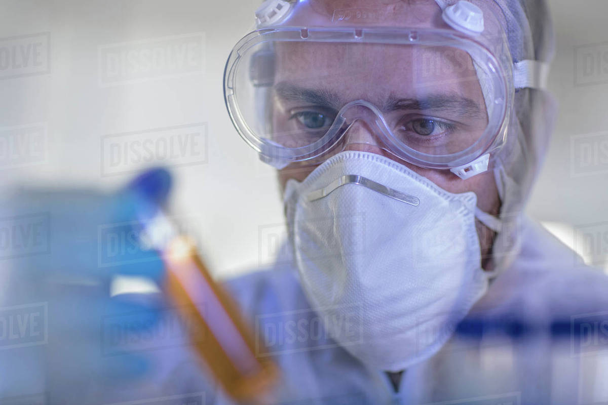 Laboratory worker holding liquid filled test tube, close-up - Stock ...