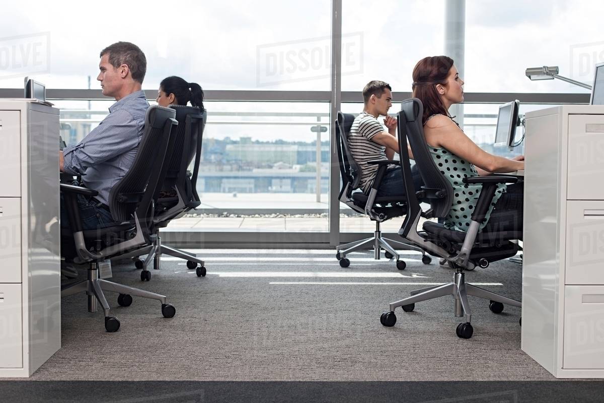 Creative business people at workstations - Royalty-free Stock Photo ...