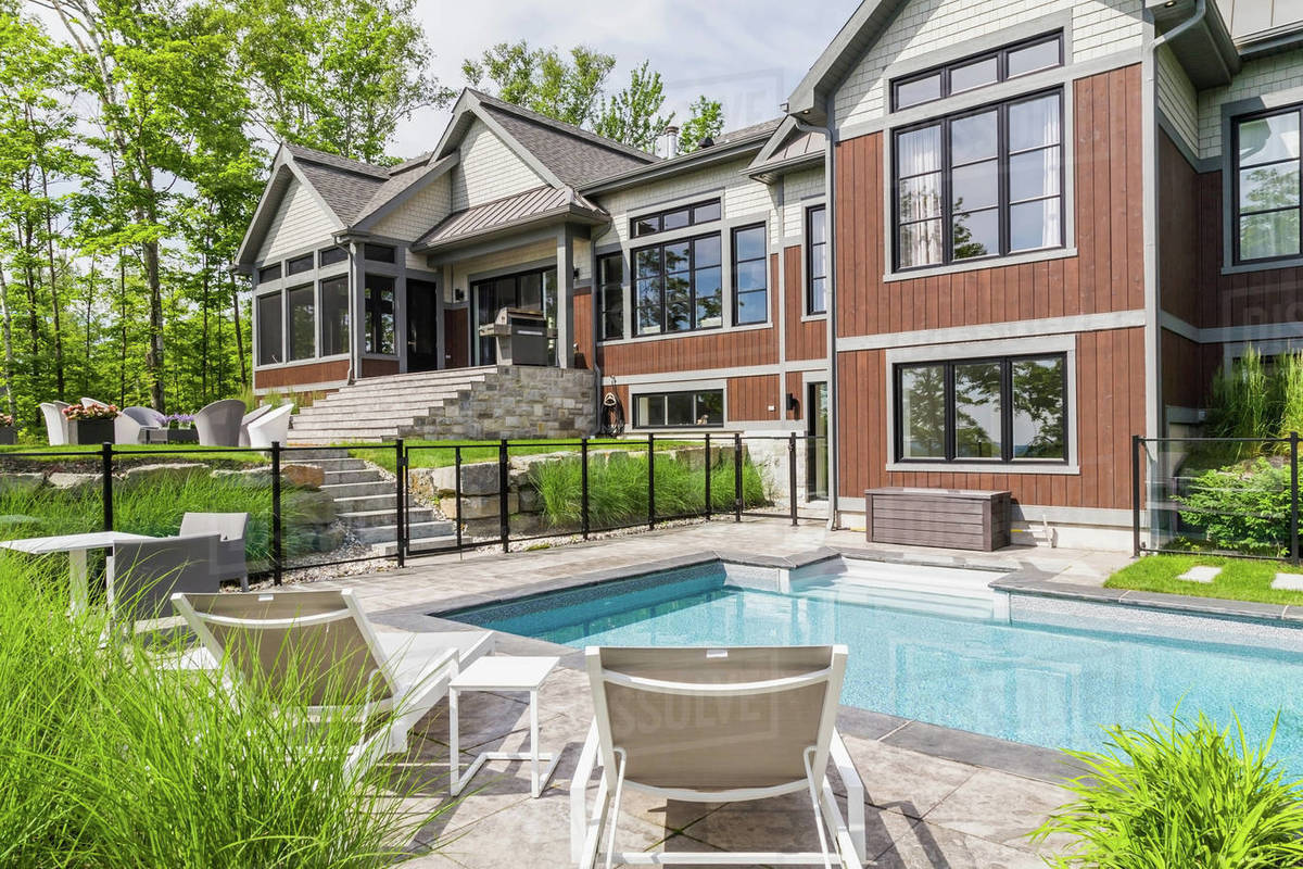 Outdoor swimming pool by luxury house, Quebec, Canada - Stock Photo ...