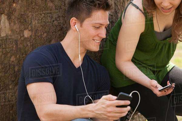 Young people listening to music - Royalty-free Stock Photo | Dissolve
