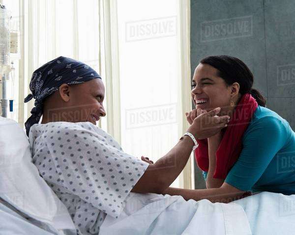 Daughter visiting mother in hospital - Royalty-free Stock Photo | Dissolve