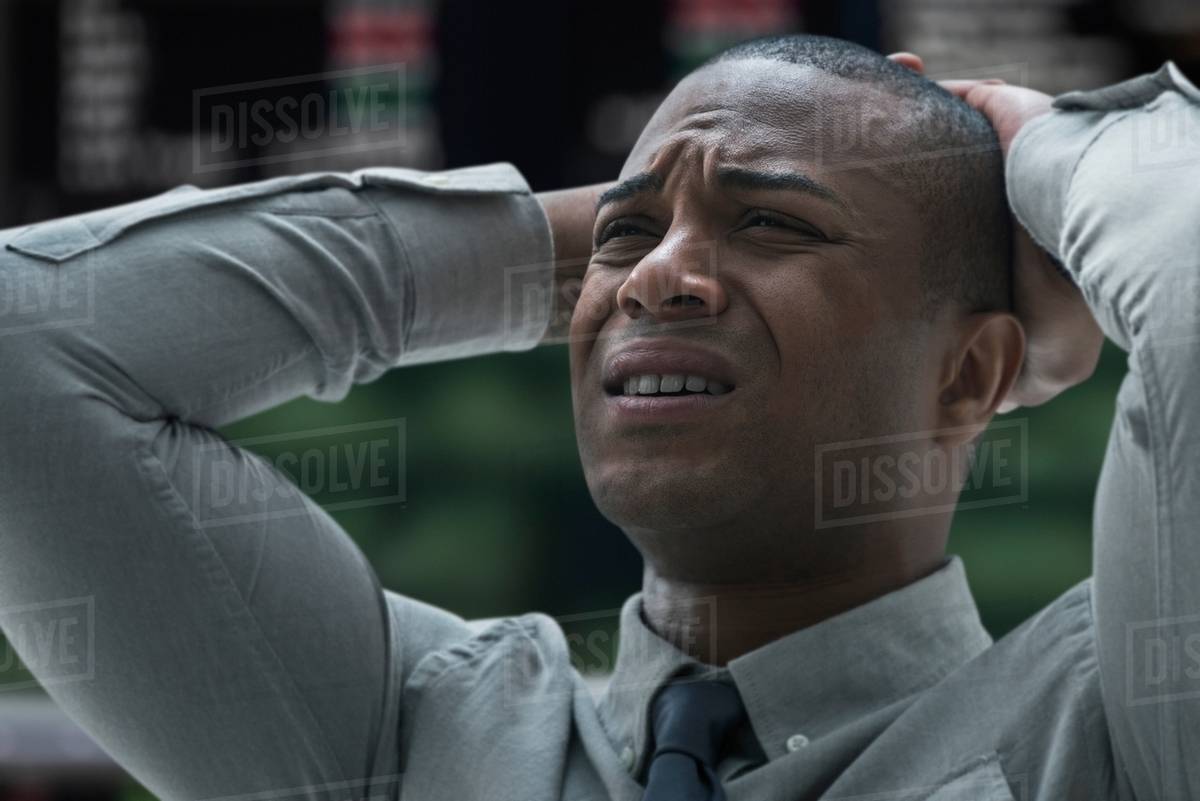 Stressed businessman at stock exchange - Stock Photo - Dissolve