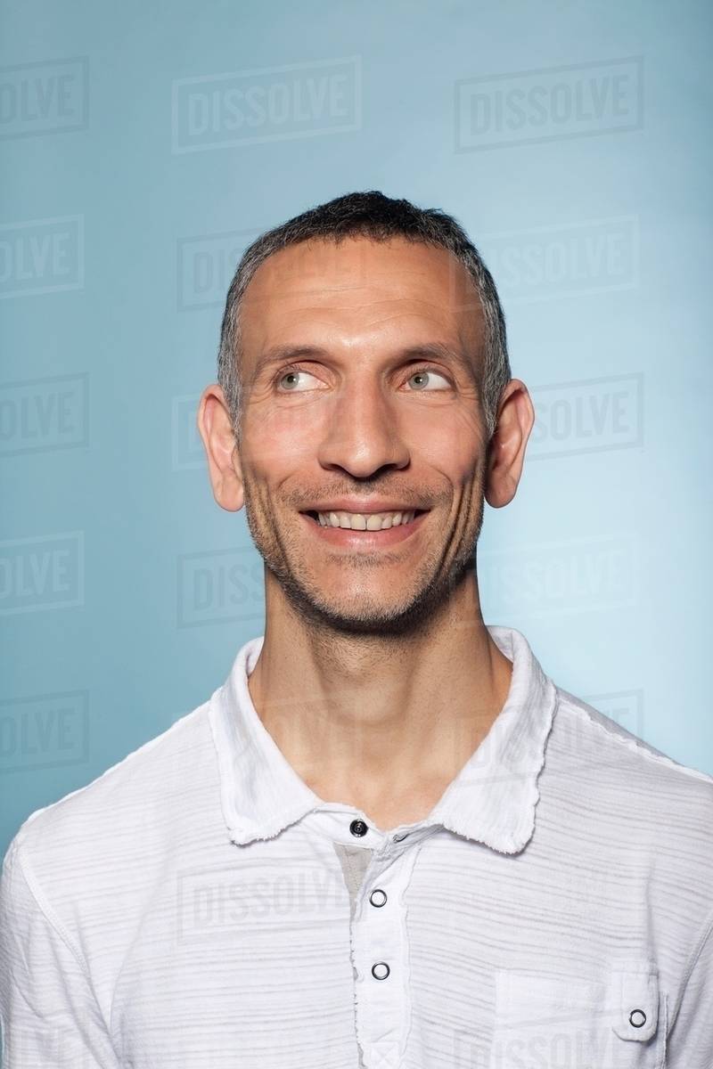 Portrait of man smiling - Stock Photo - Dissolve