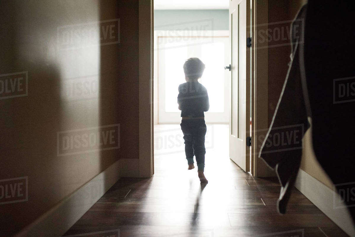 Boy running out of room - Royalty-free Stock Photo | Dissolve