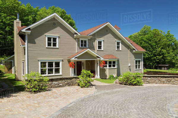 1990s Contemporary Victorian style country home facade with hanging ...