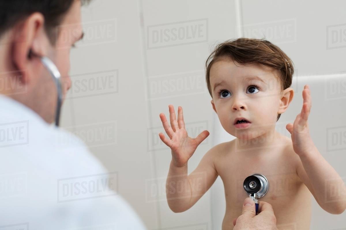 Doctor using stethoscope to check little boy - Royalty-free Stock Photo ...