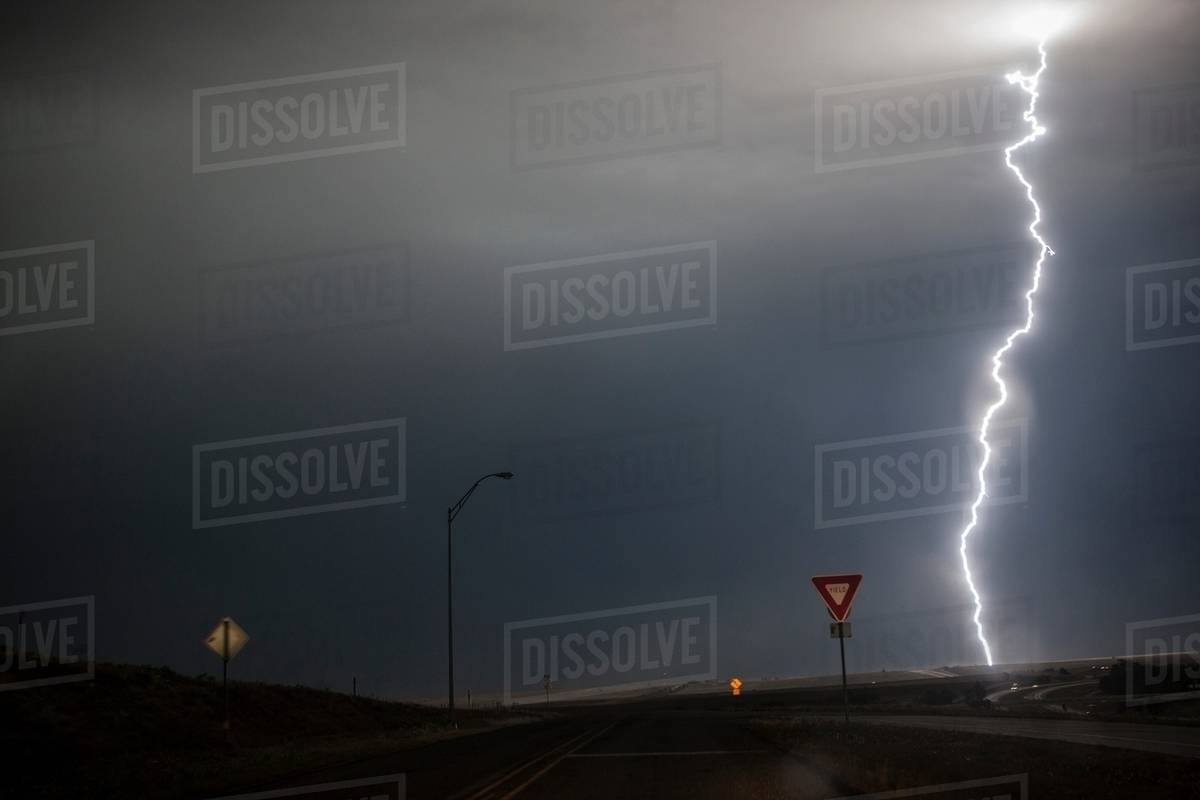 Lightning above a road - Royalty-free Stock Photo | Dissolve