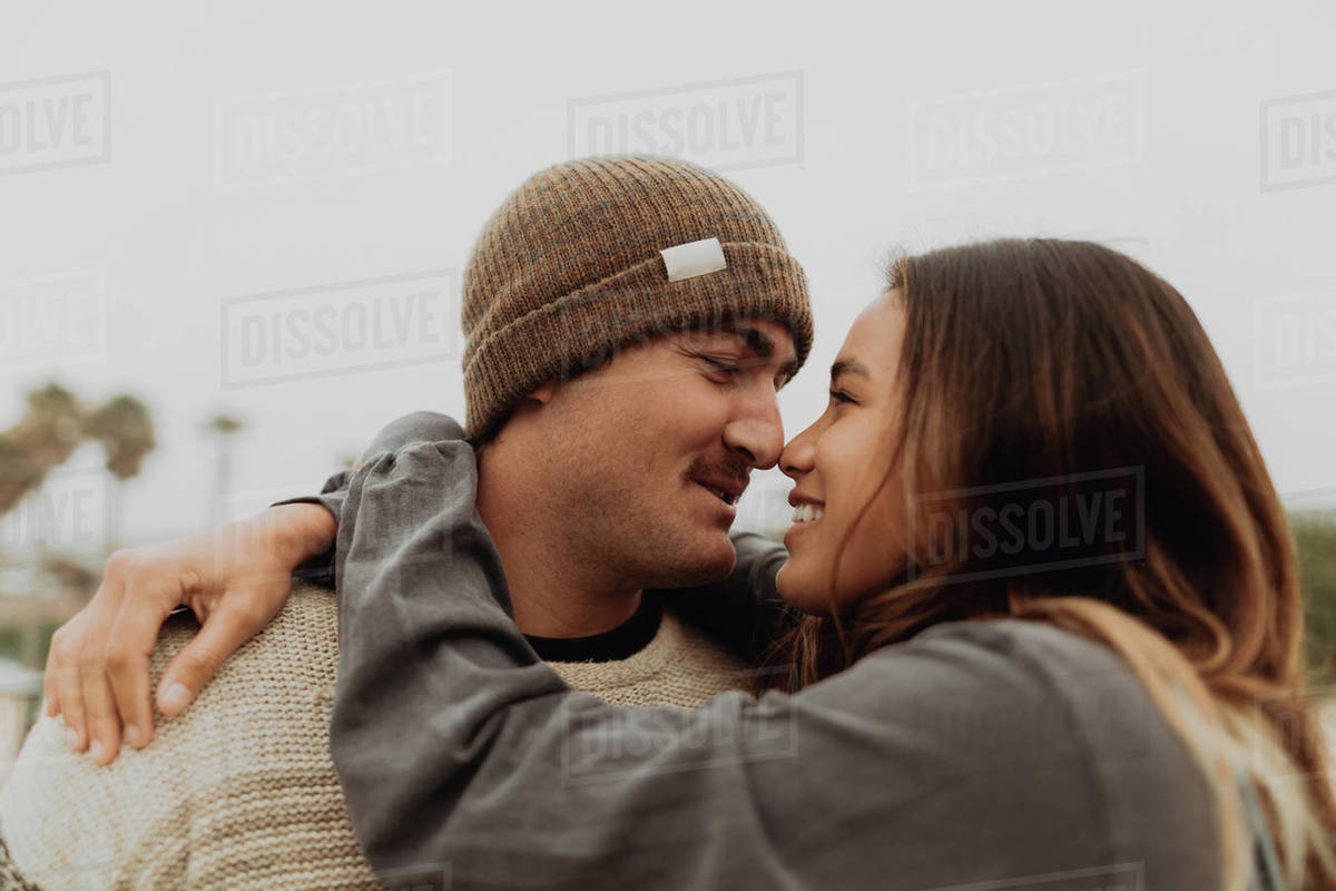 Romantic young couple face to face on beach, Jalama, California, USA ...