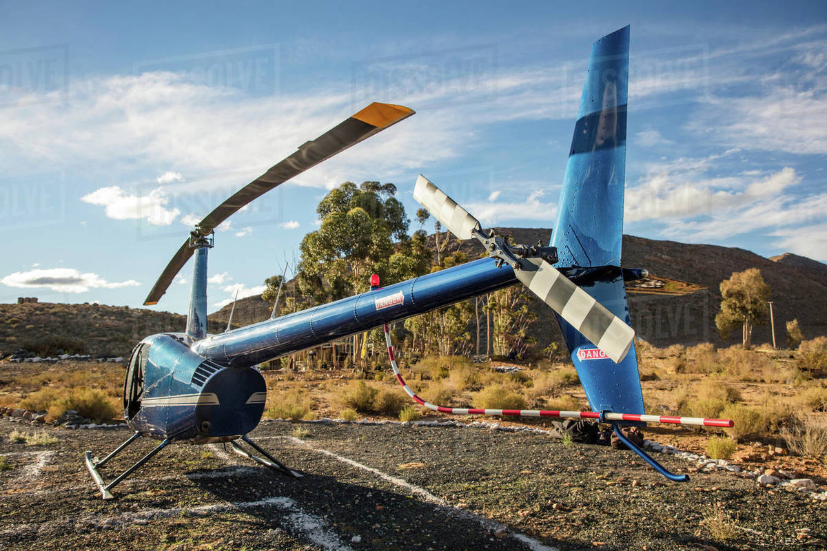 Helicopter on ground in rural landscape, rear view, Cape Town, Western ...