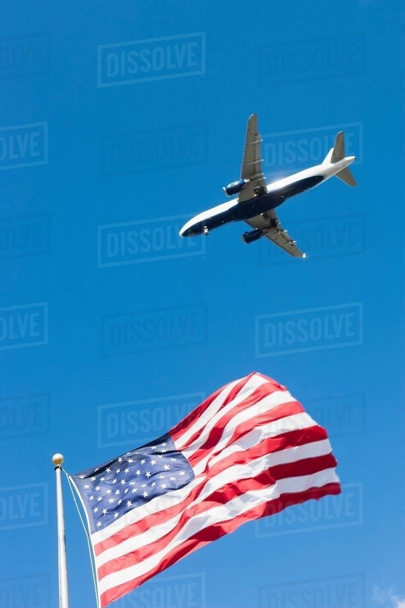 Aeroplane and US flag - Royalty-free Stock Photo | Dissolve