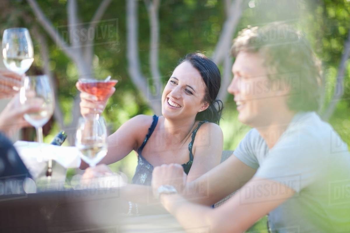 Friends toasting each other outdoors - Royalty-free Stock Photo | Dissolve