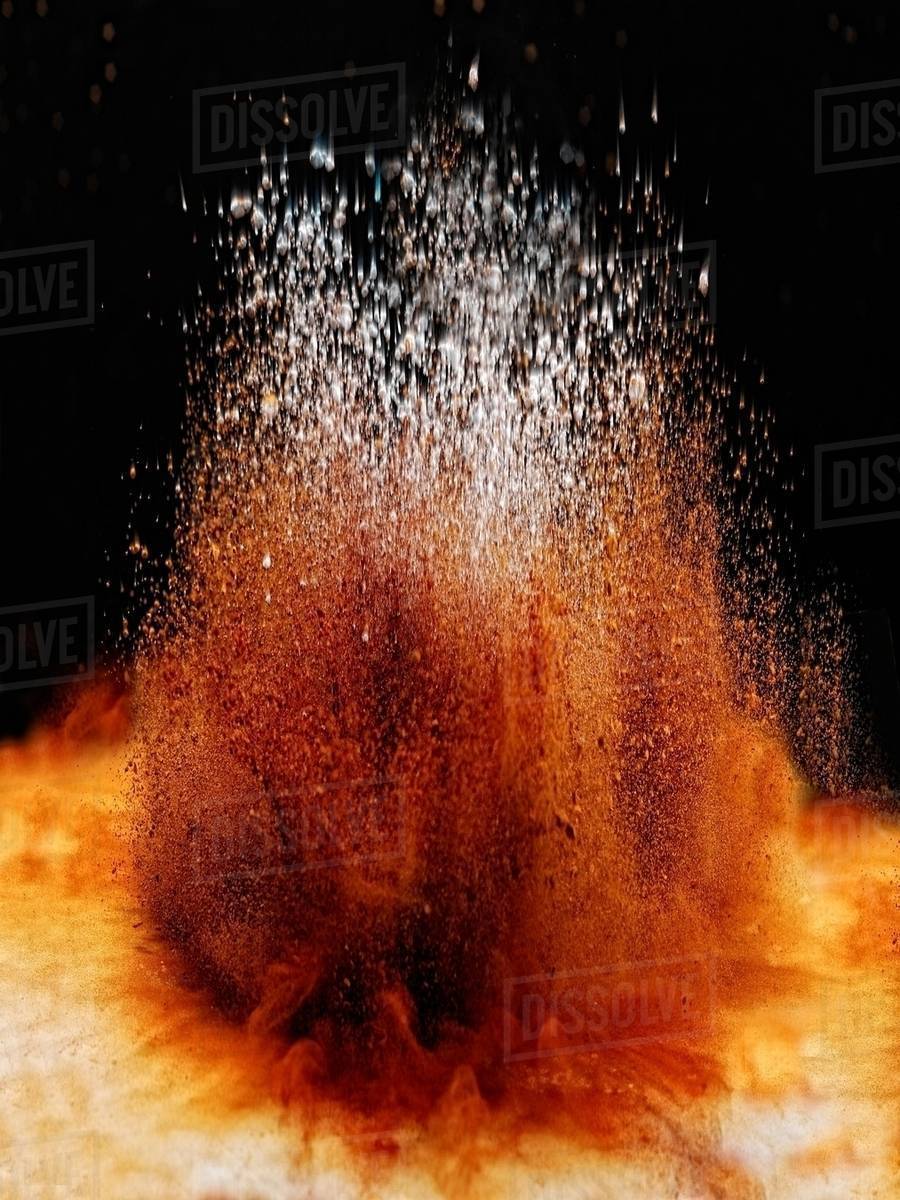 Dirt exploding on ground - Stock Photo - Dissolve
