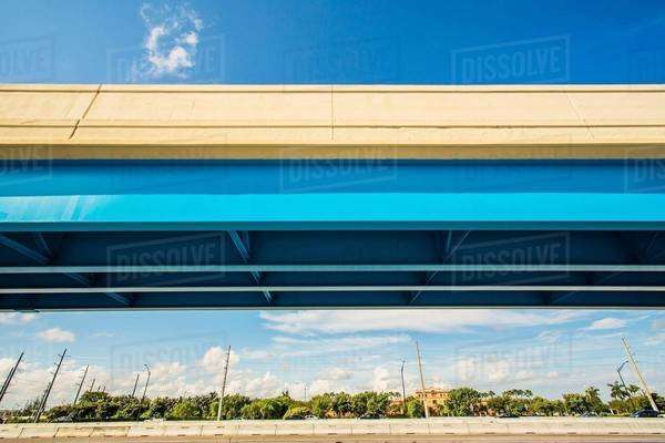Freeway overpass in suburban landscape - Stock Photo - Dissolve