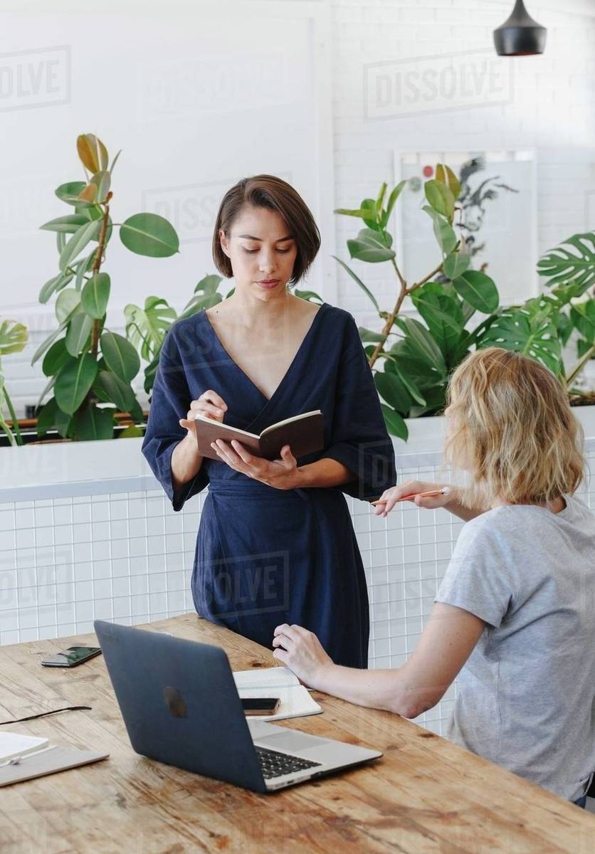 Colleagues having discussion in office - Royalty-free Stock Photo ...