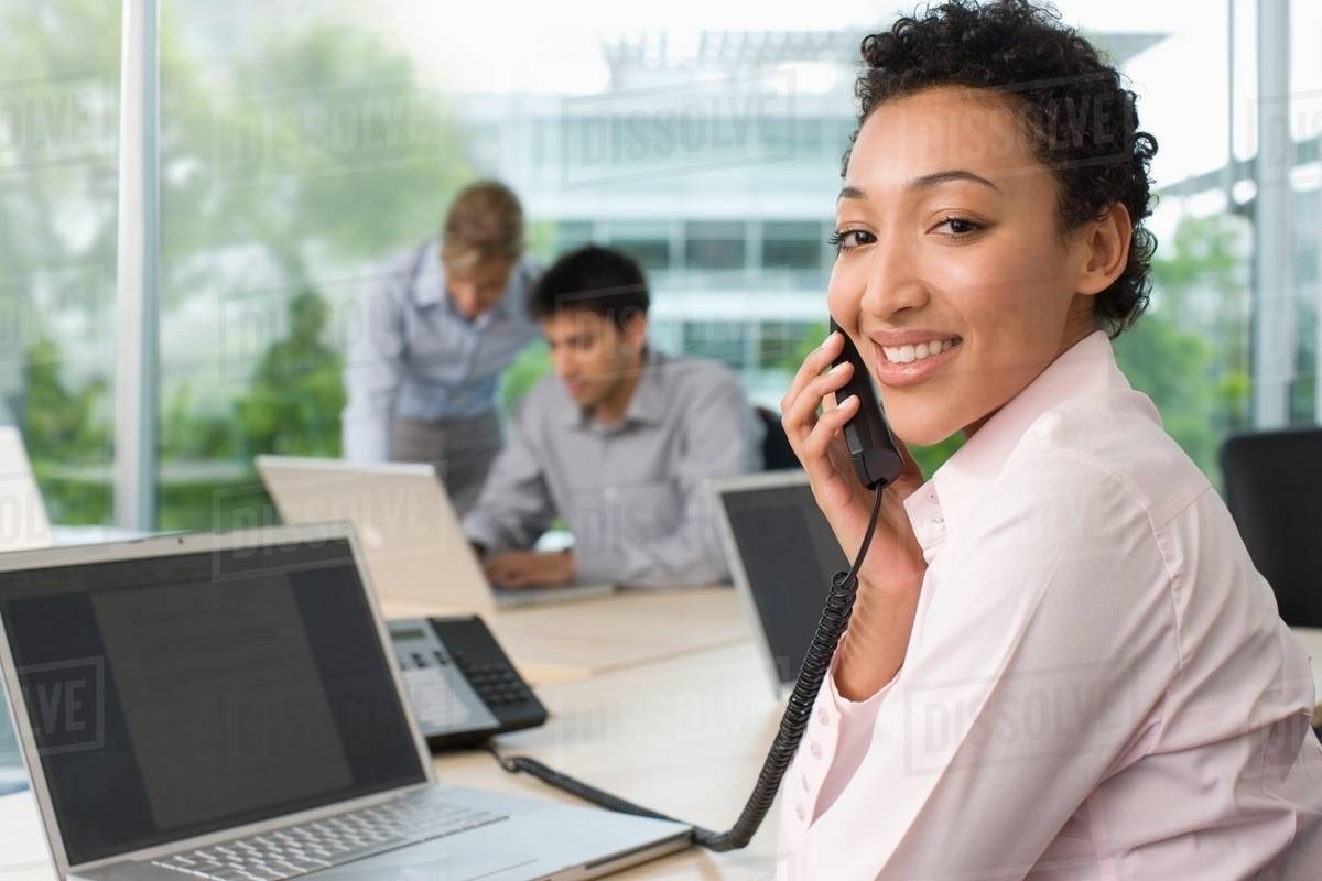 Office worker on telephone - Royalty-free Stock Photo | Dissolve