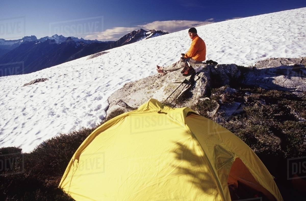 Climber and tent at north cascades national park - Stock Photo - Dissolve