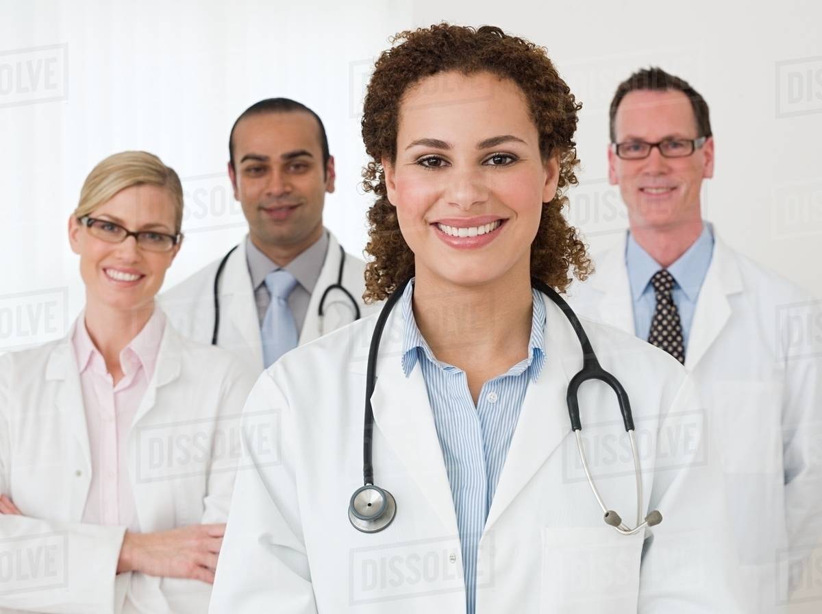 Portrait of four doctors - Stock Photo - Dissolve