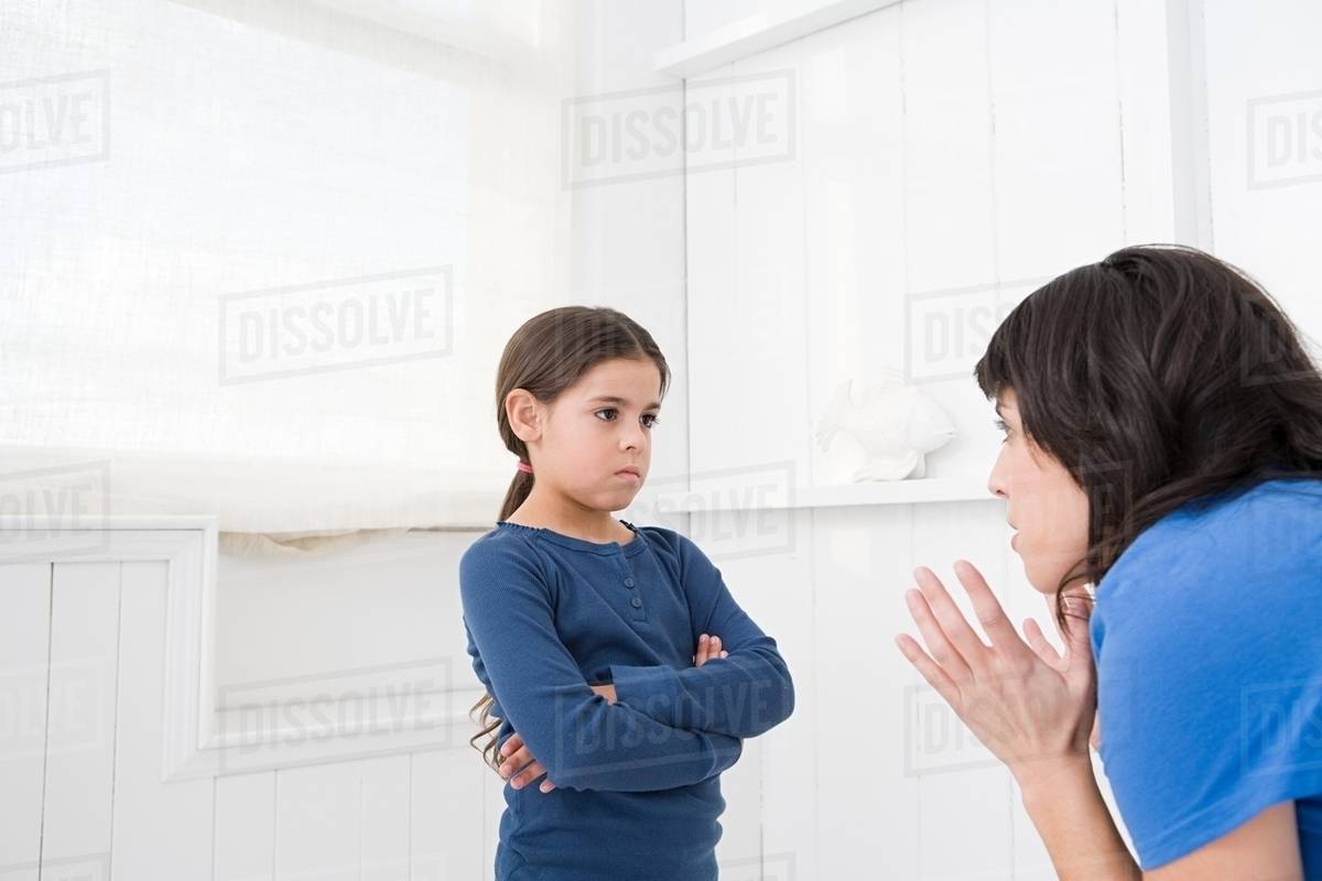 Mother disciplining her daughter - Stock Photo - Dissolve