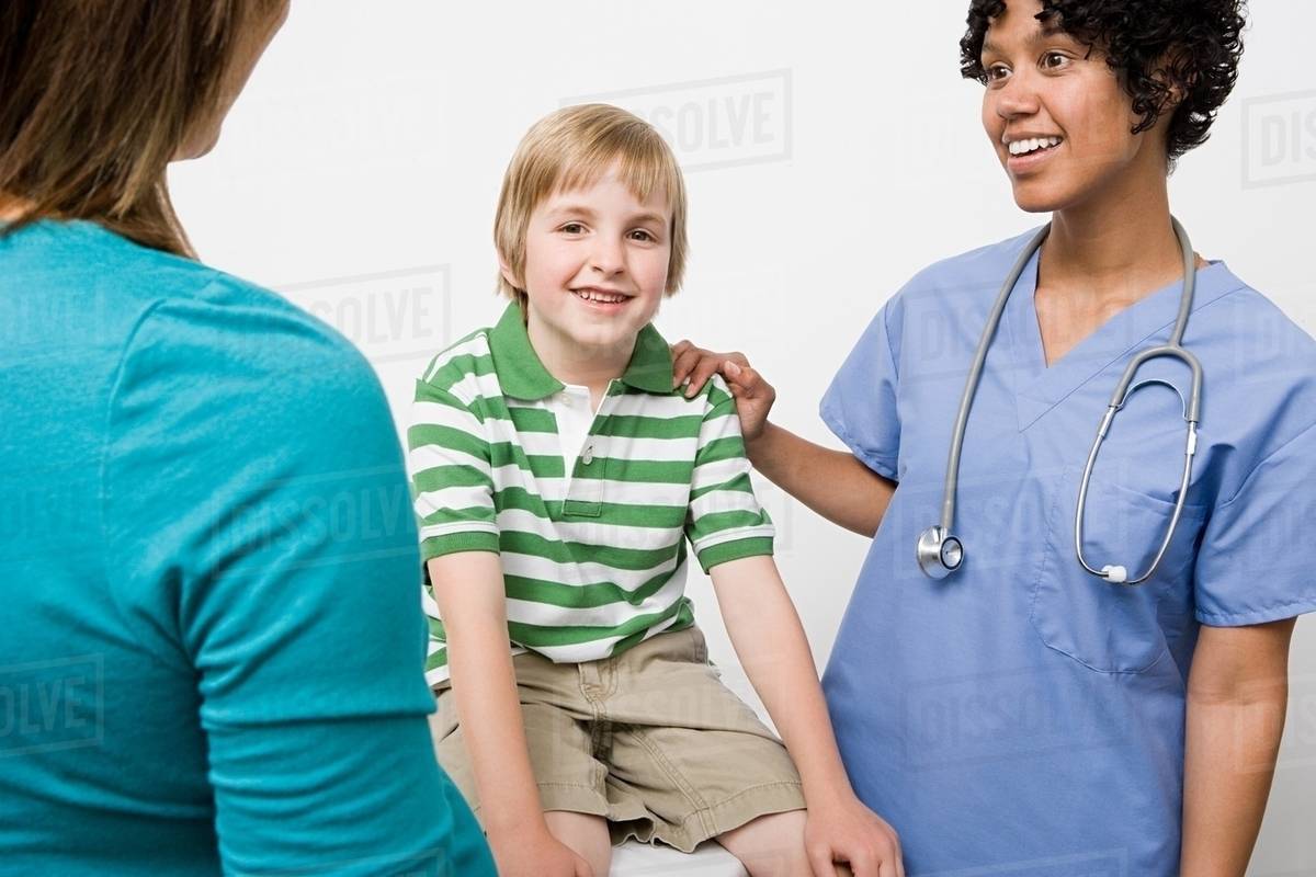 Boy with nurse and parent - Royalty-free Stock Photo | Dissolve