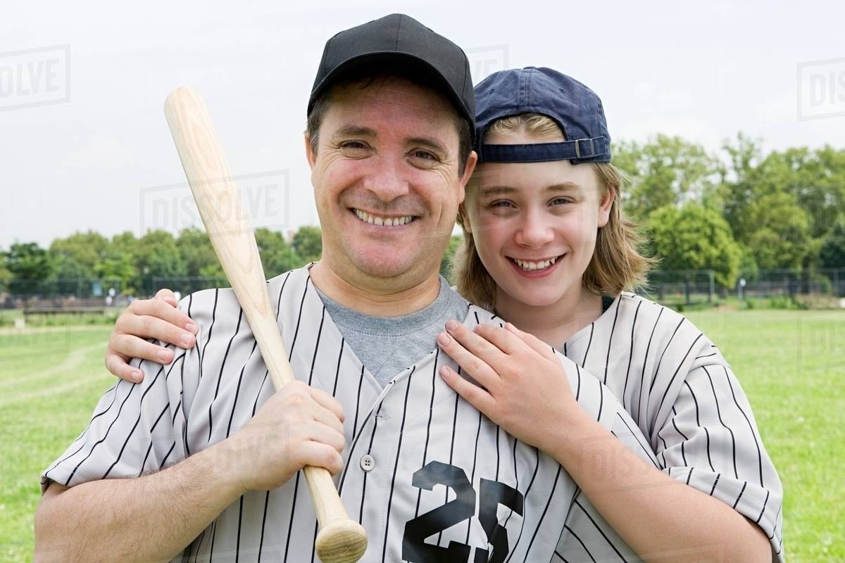 Father and son on baseball field - Royalty-free Stock Photo | Dissolve