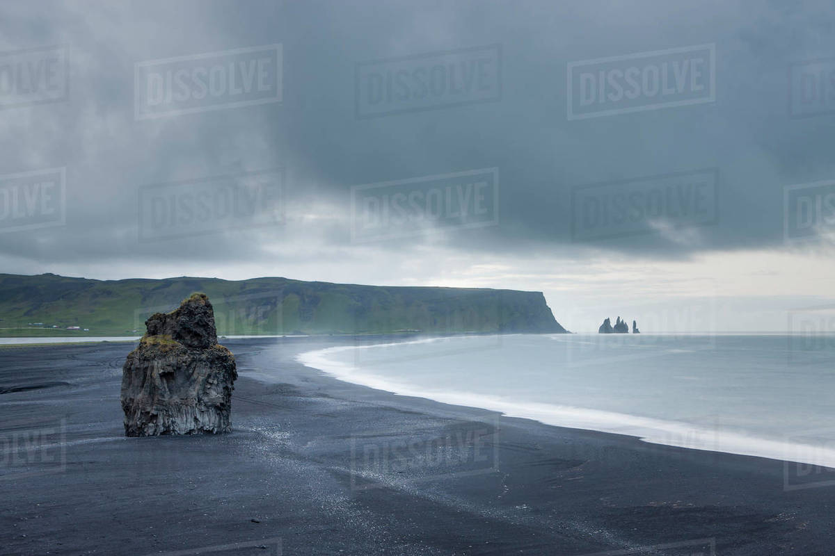 Reynisdrangar basalt sea stacks on coastline, Reynis beach, Reynisfjara ...