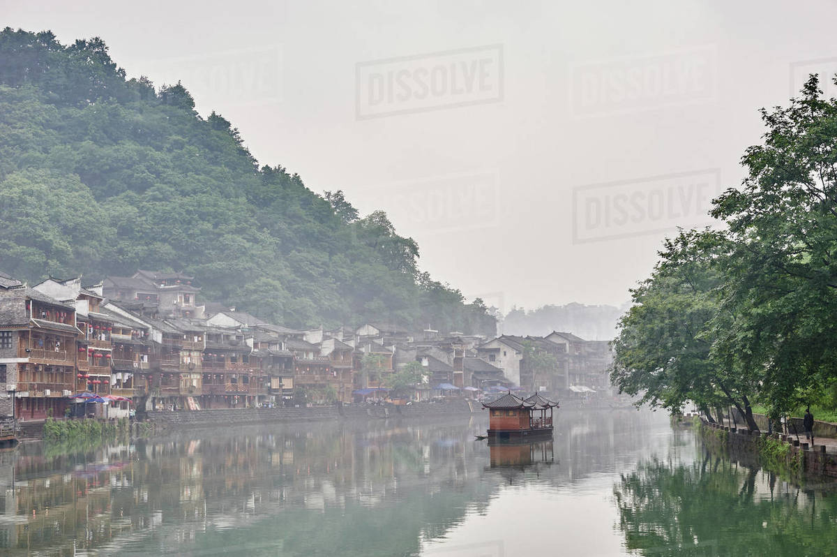 Traditional buildings on river edge, Fenghuang, Hunan, China - Royalty ...