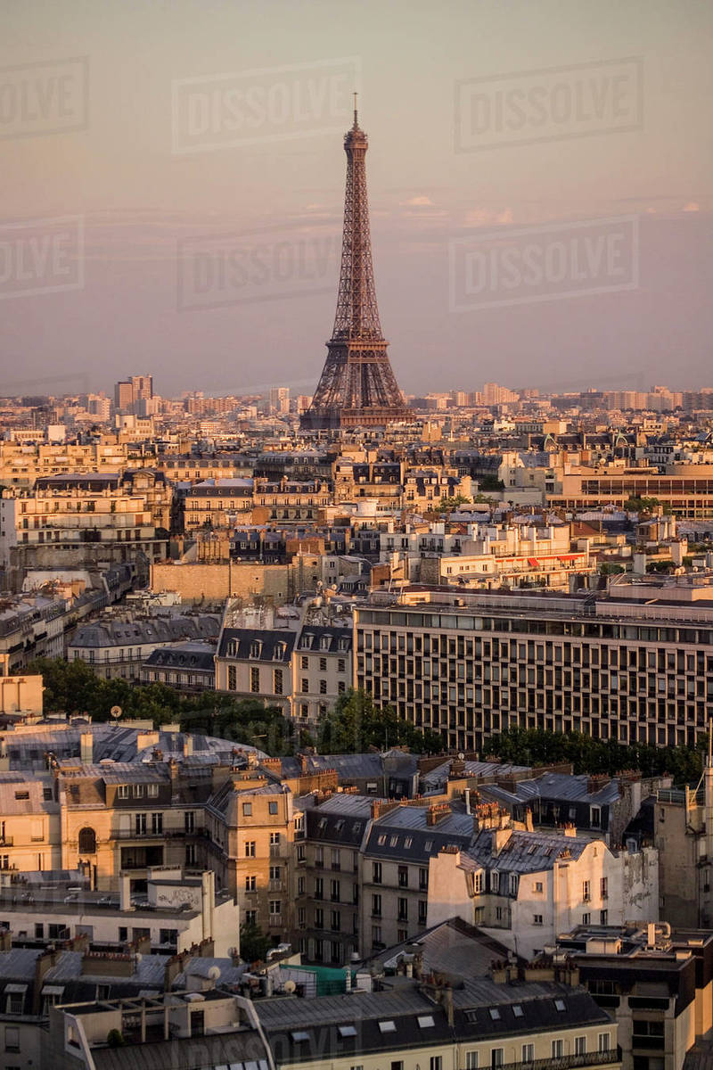 Elevated cityscape of rooftops and Eiffel Tower, Paris, France ...