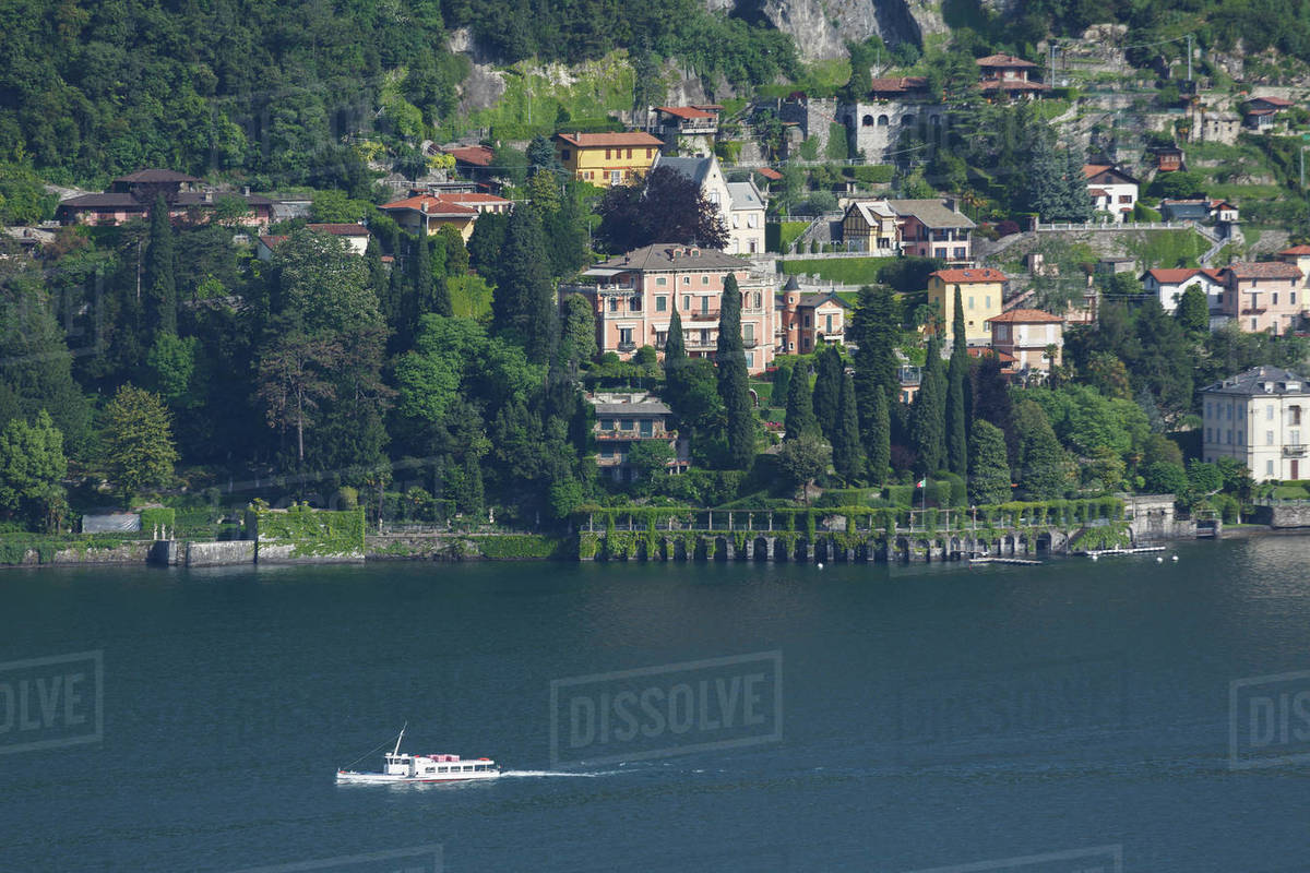 Elevated view of ferry and the village of Laglio village, Lake Como ...