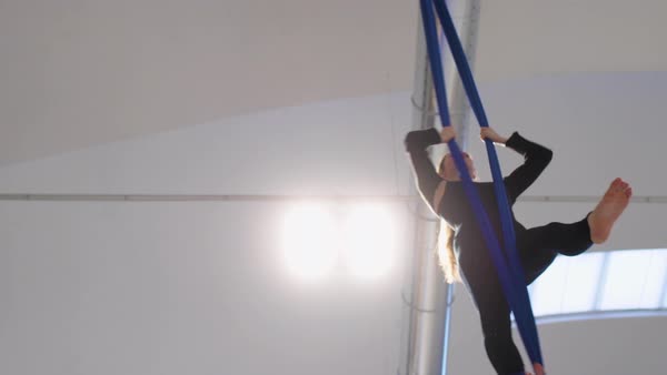 Acrobat doing aerial silk - Stock Video Footage - Dissolve