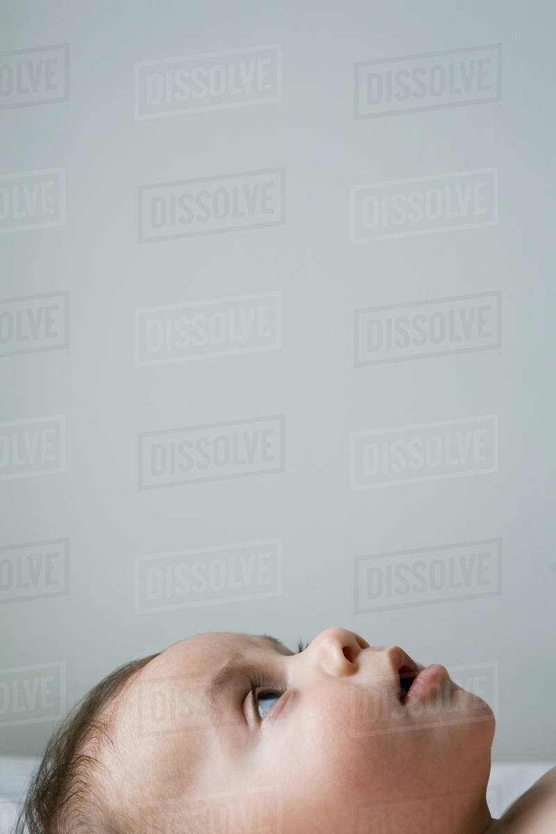 Baby boy looking up - Royalty-free Stock Photo | Dissolve
