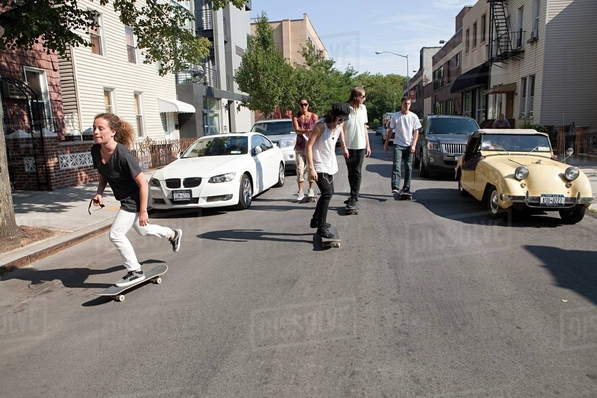 Skateboarders on urban street - Royalty-free Stock Photo | Dissolve