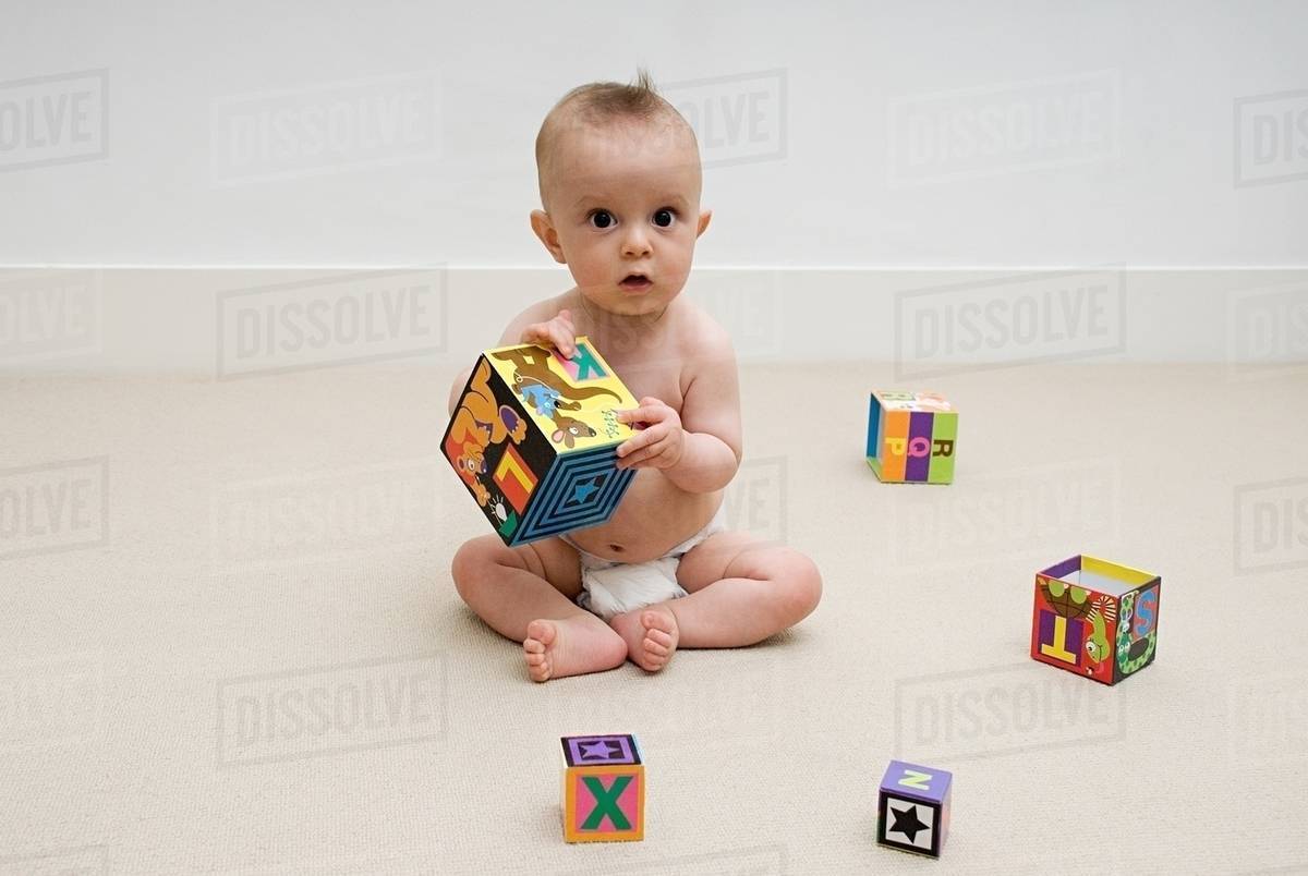 Baby playing with toy blocks - Royalty-free Stock Photo | Dissolve