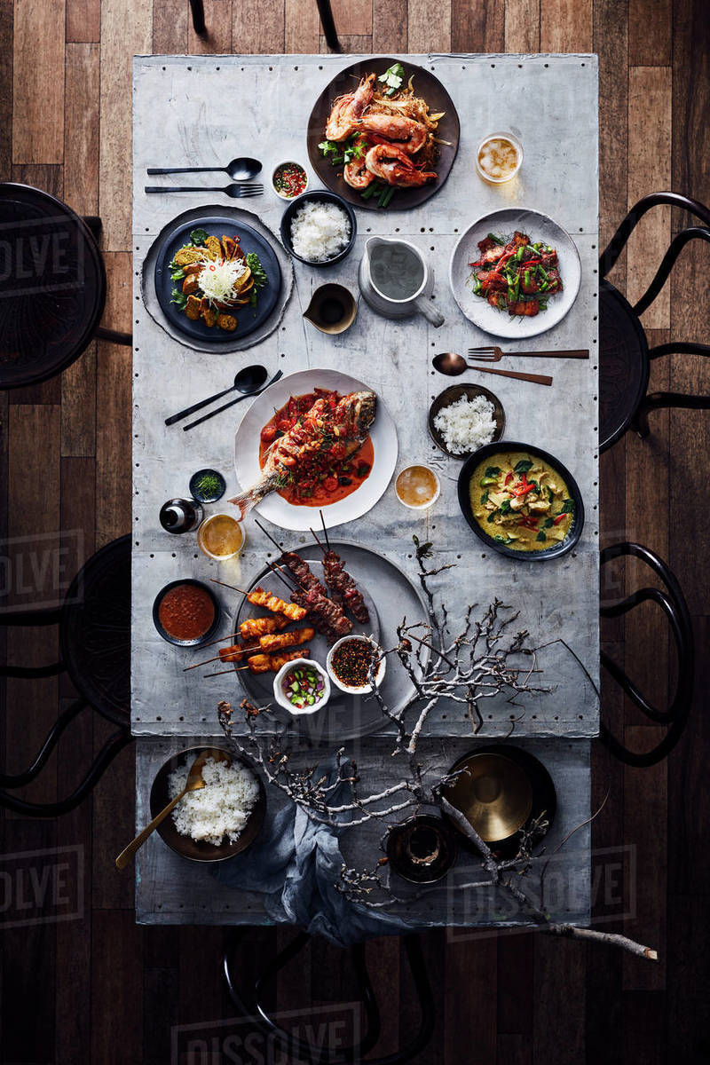 Table with authentic Thai menu dishes - Royalty-free Stock Photo | Dissolve