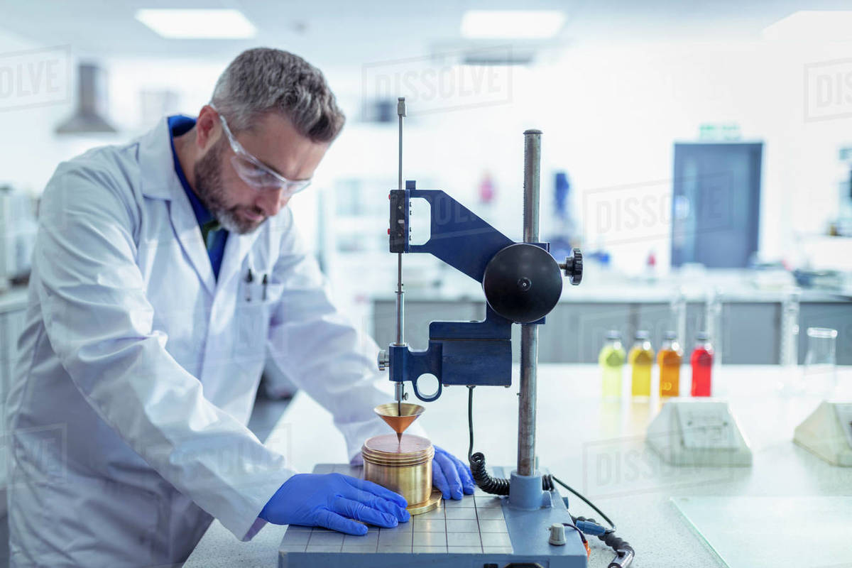 Laboratory worker mixing grease in oil blending plant - Stock Photo ...