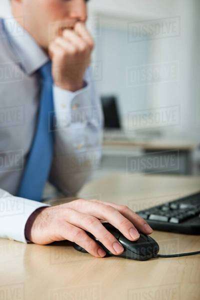 Office worker using computer - Stock Photo - Dissolve