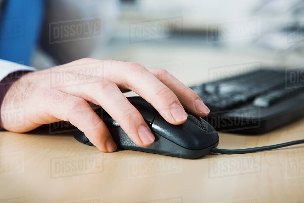 Office worker using computer - Royalty-free Stock Photo | Dissolve