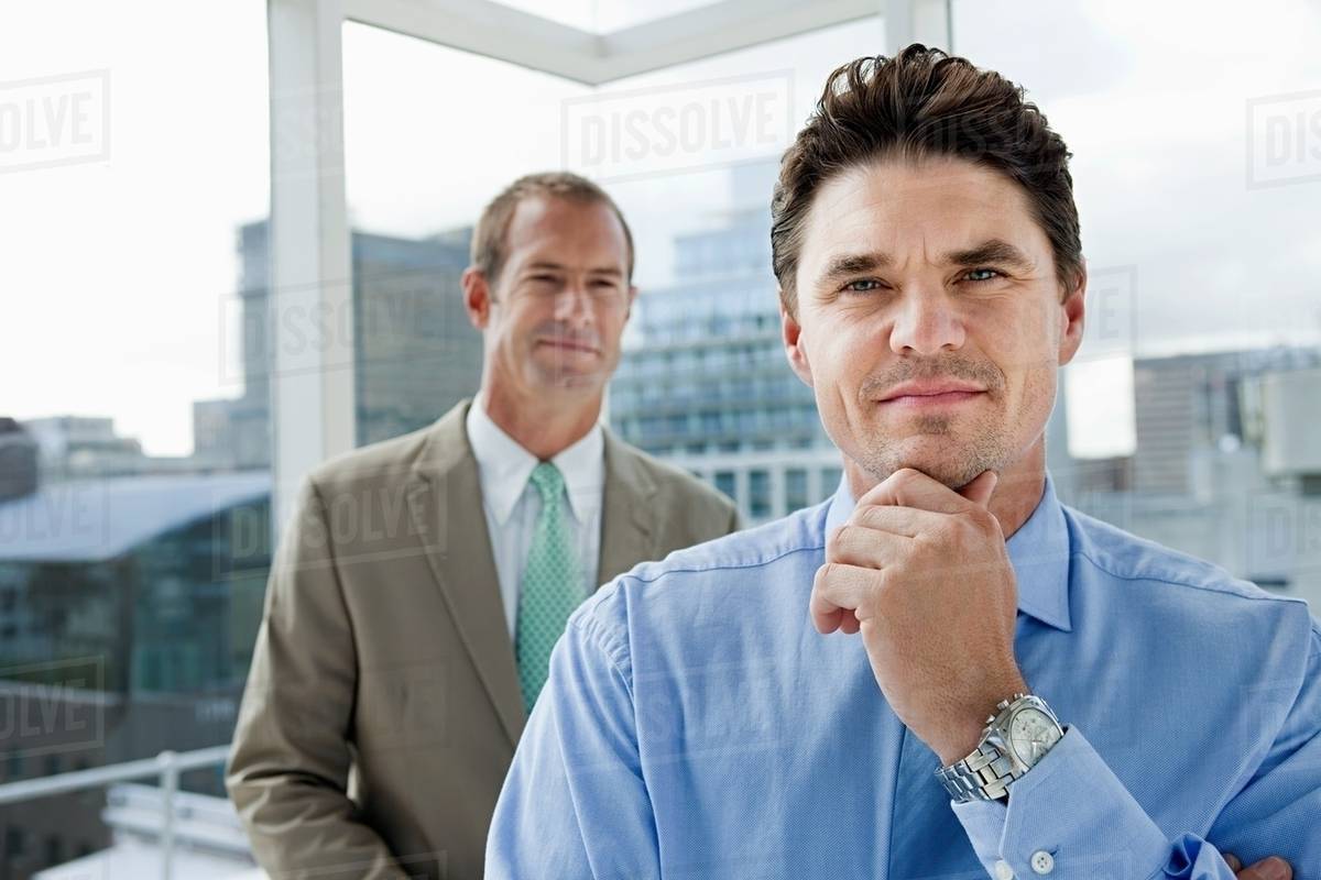 Two businessmen in office, portrait - Royalty-free Stock Photo | Dissolve