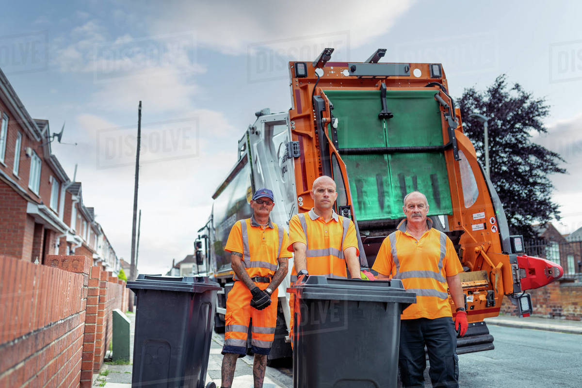 Portrait of refuse collectors with bins and refuse truck - Royalty-free ...