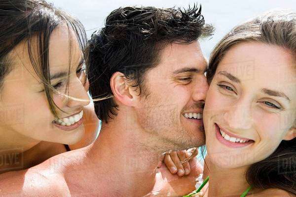 Three people, close up portrait - Royalty-free Stock Photo | Dissolve