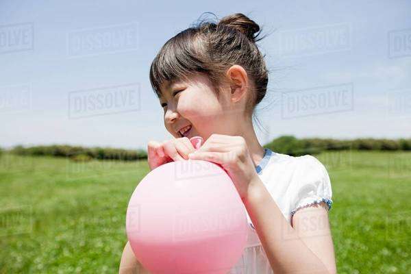 Girl with pink balloon - Royalty-free Stock Photo | Dissolve