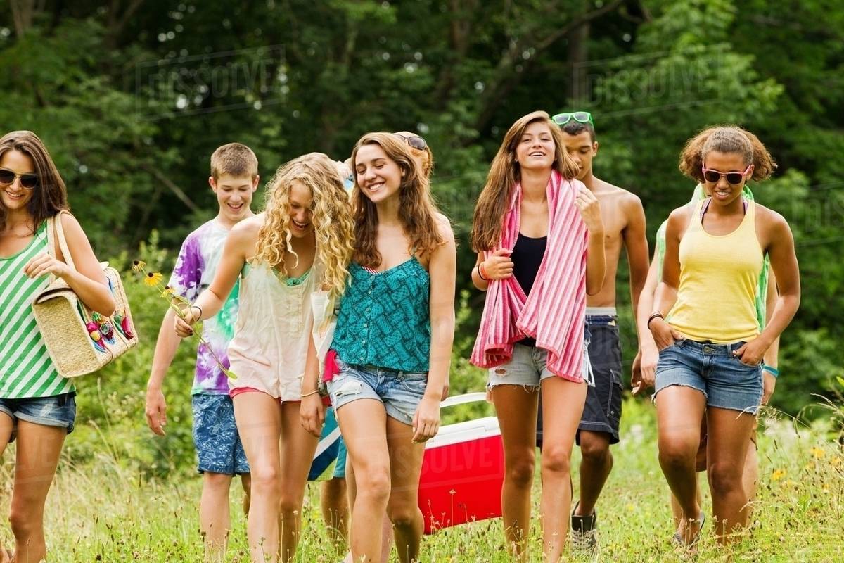 Teenagers going on a picnic together in the countryside - Royalty-free ...